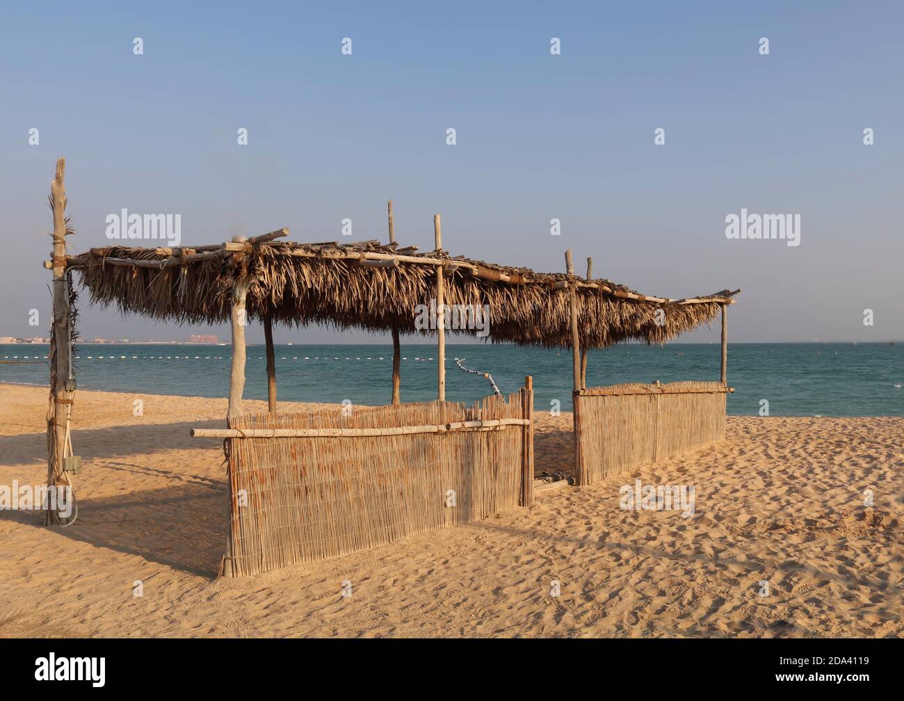 A palm shed on a beach in Doha Qatar Stock Photo - Alamy