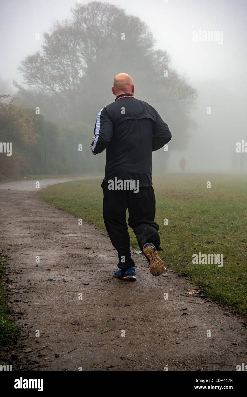 Middle man running behind hi-res stock photography and images - Alamy