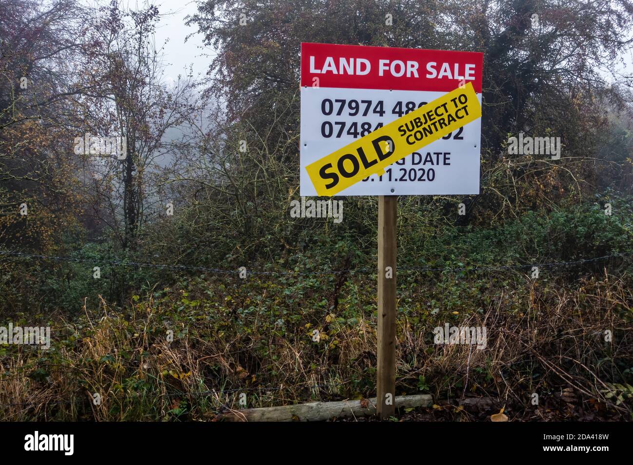 Land for sale sign with sold banner on it Stock Photo - Alamy