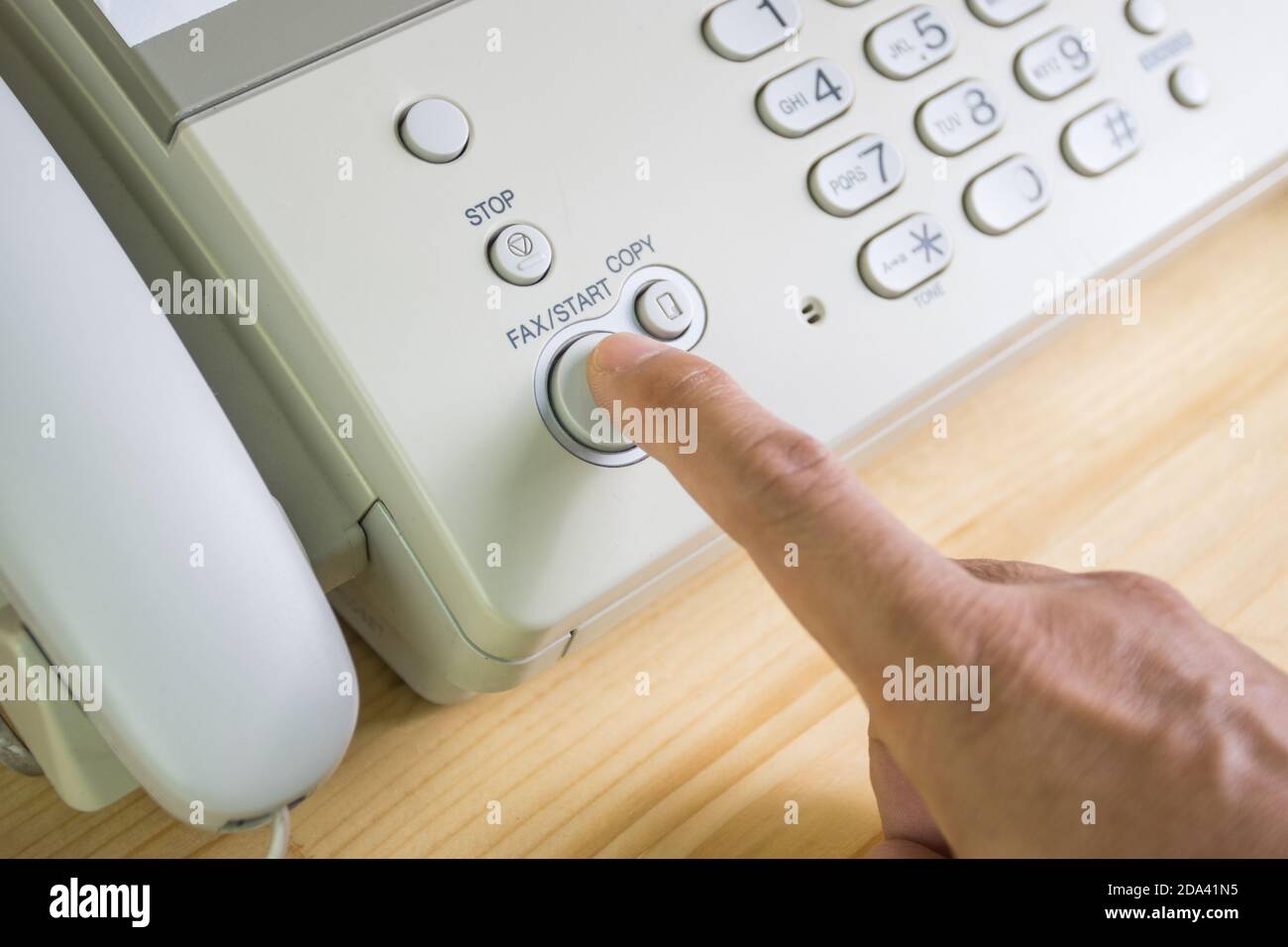 hand man are using a fax machine in the office, equipment for data ...
