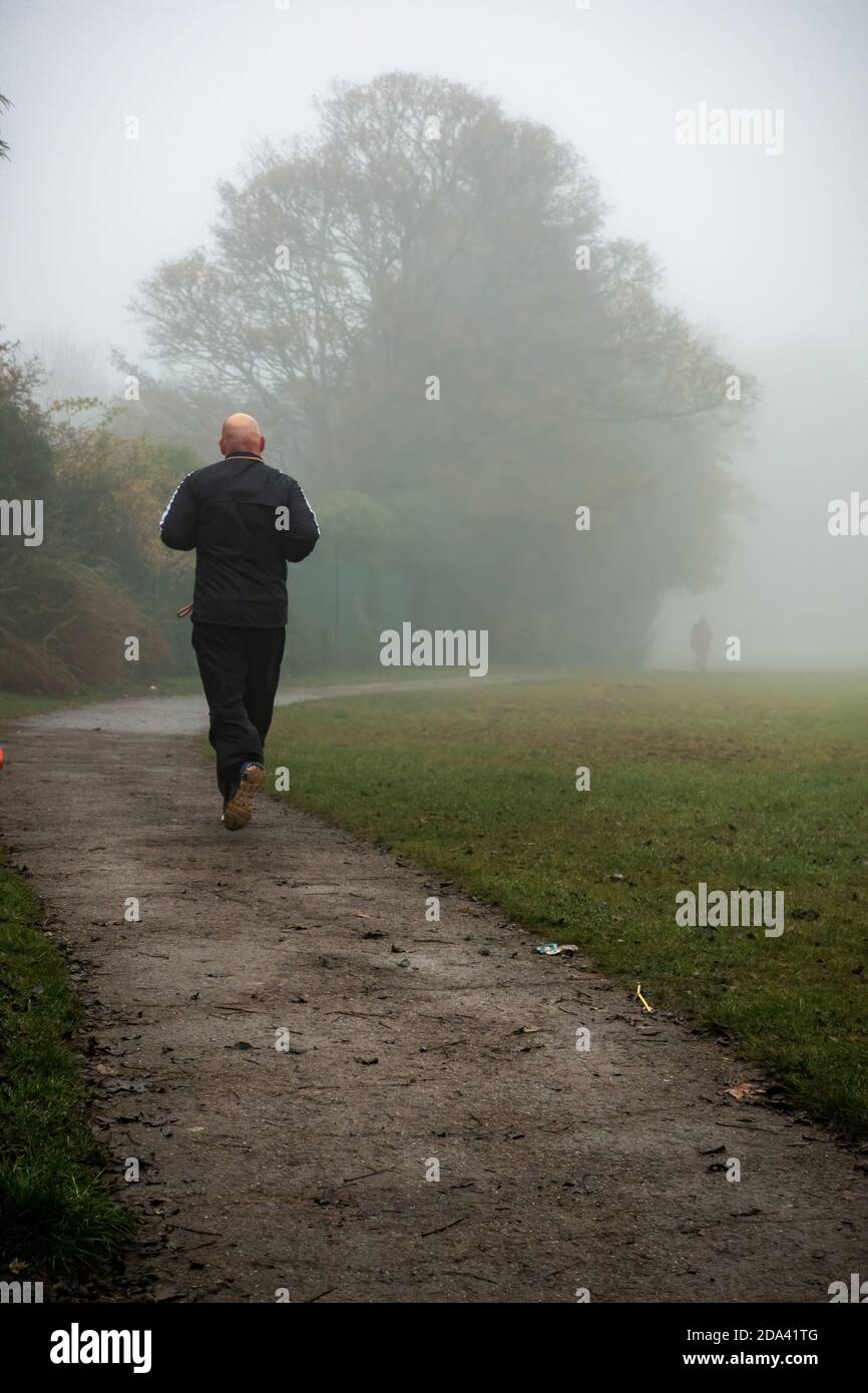 Middle man running behind hi-res stock photography and images - Alamy