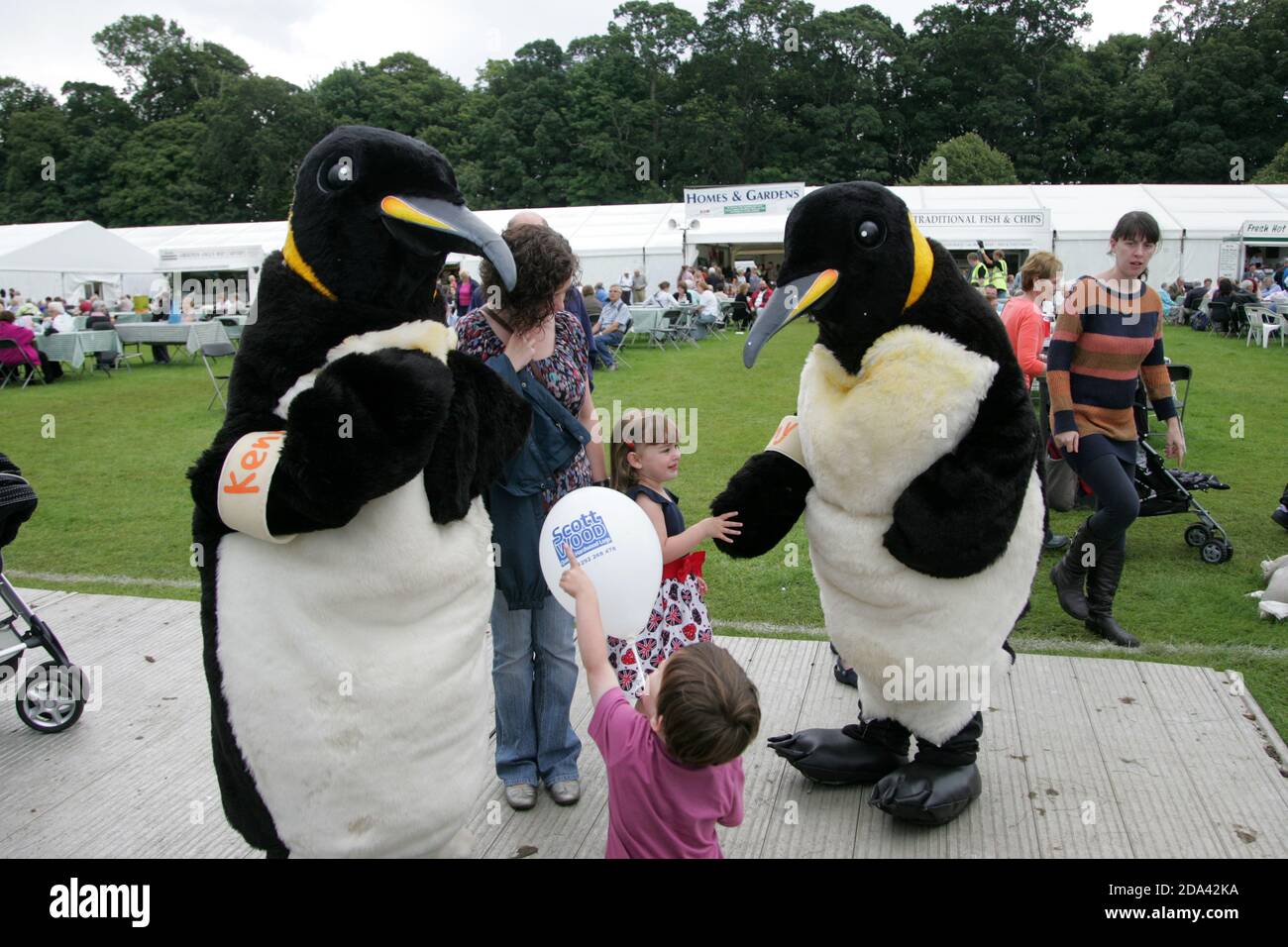Ayr Flower Show, Ayrshire, Scotland. Large penquins entertain children ...