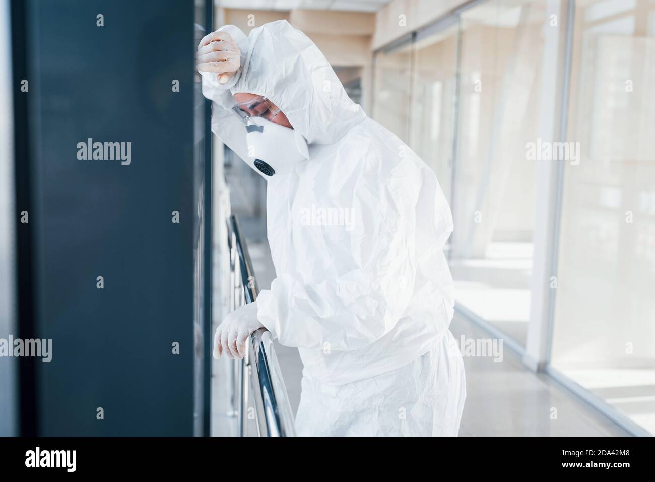 Feels bad and sick. Female doctor scientist in lab coat, defensive ...