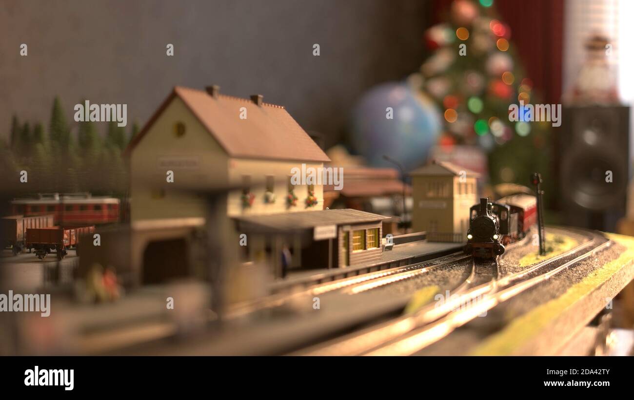 Toy train model on a town railway Stock Photo - Alamy