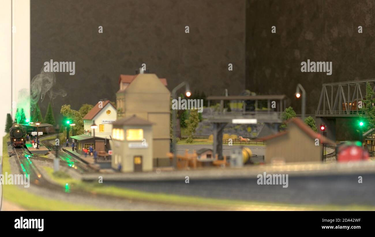 Toy railway station with countryside Stock Photo - Alamy