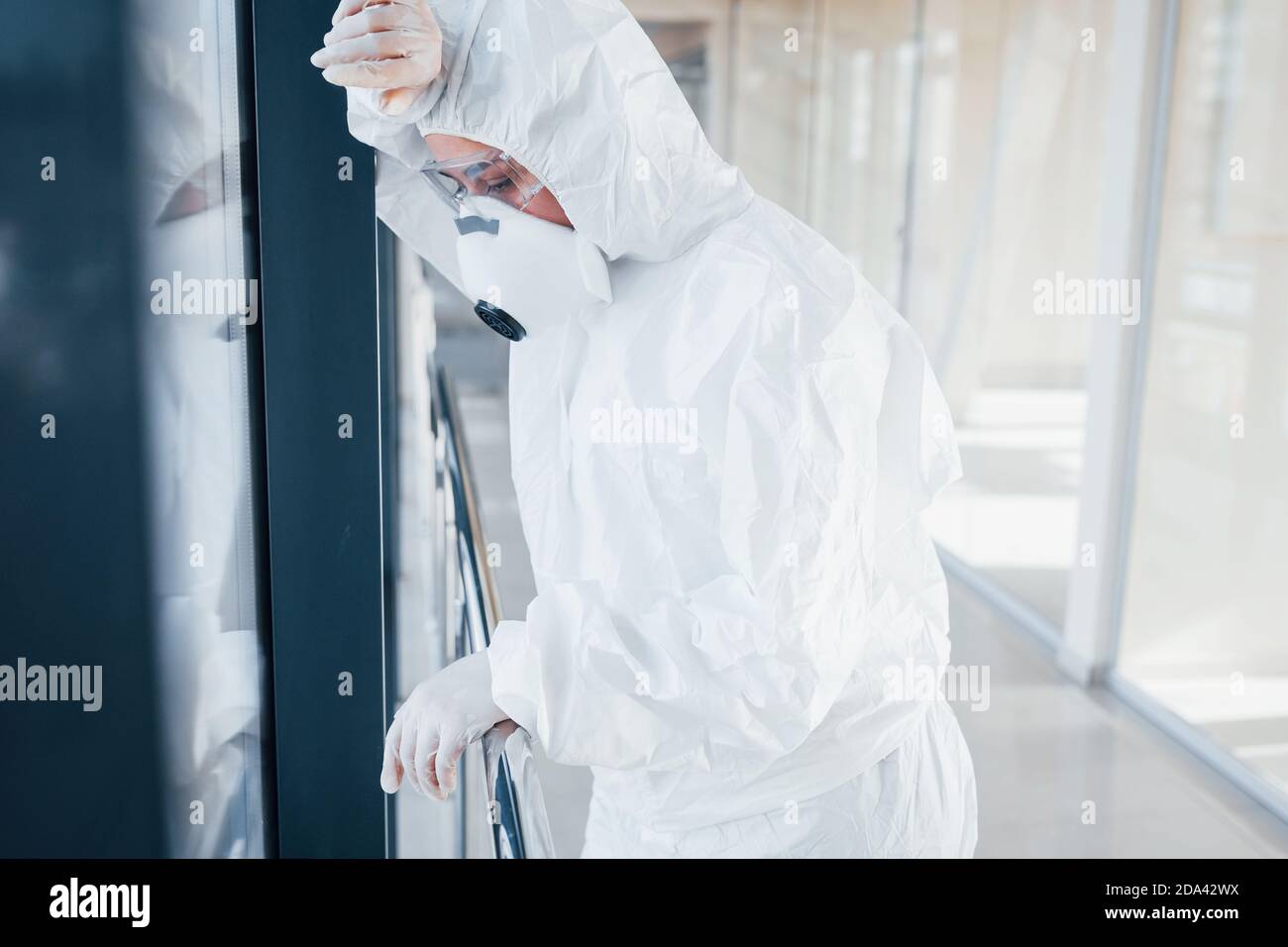 Feels bad and sick. Female doctor scientist in lab coat, defensive ...