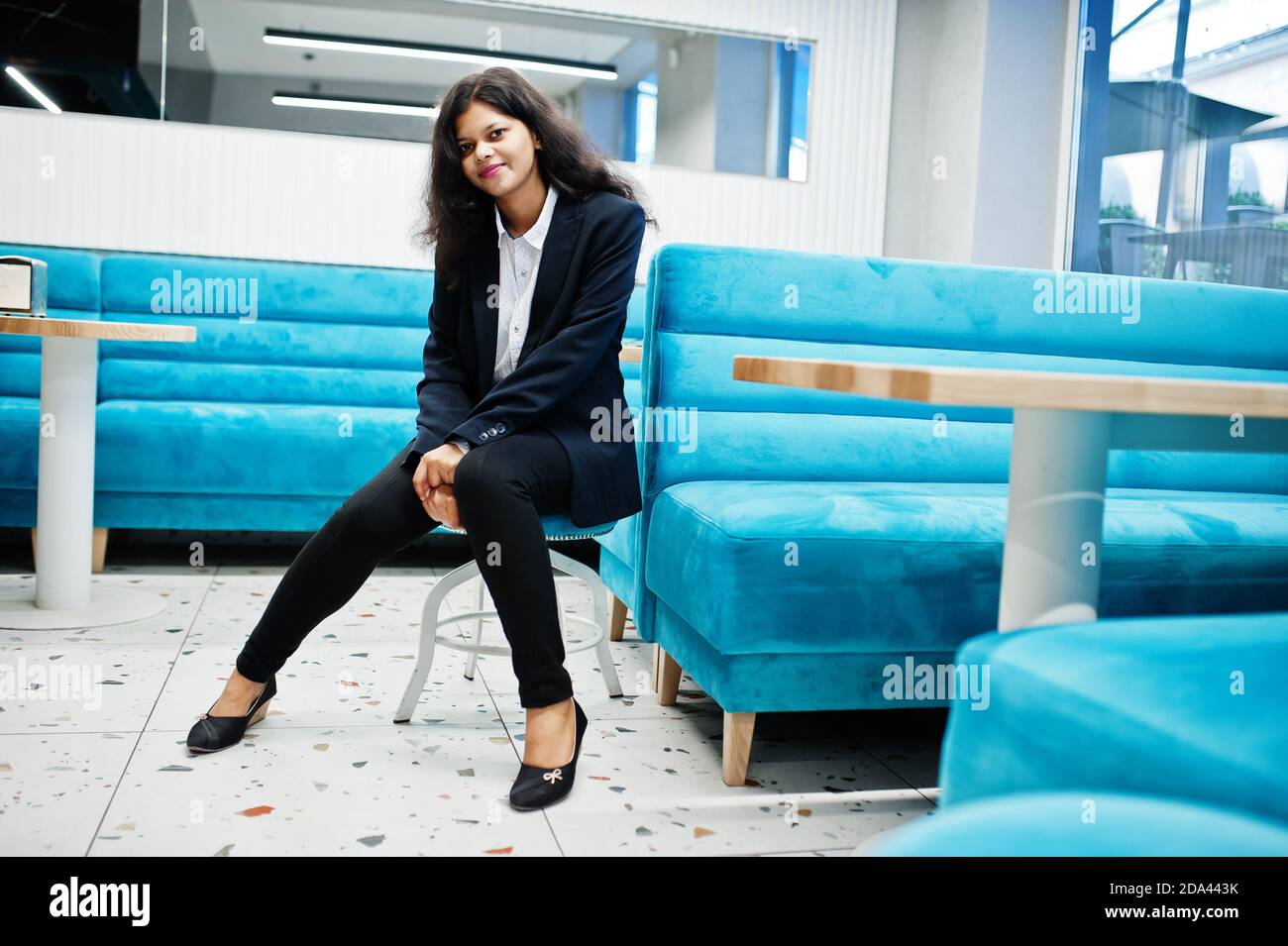 Gorgeous indian woman wear formal posing at cafe Stock Photo - Alamy