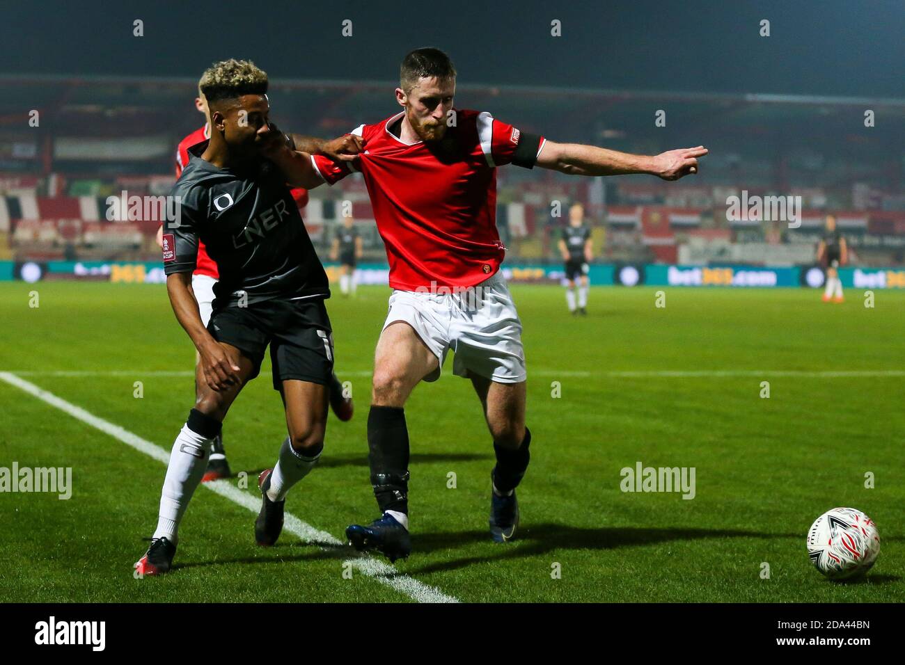 FC United of Manchester’s Adam Dodd and Doncaster Rovers’ Jason Lokilo ...