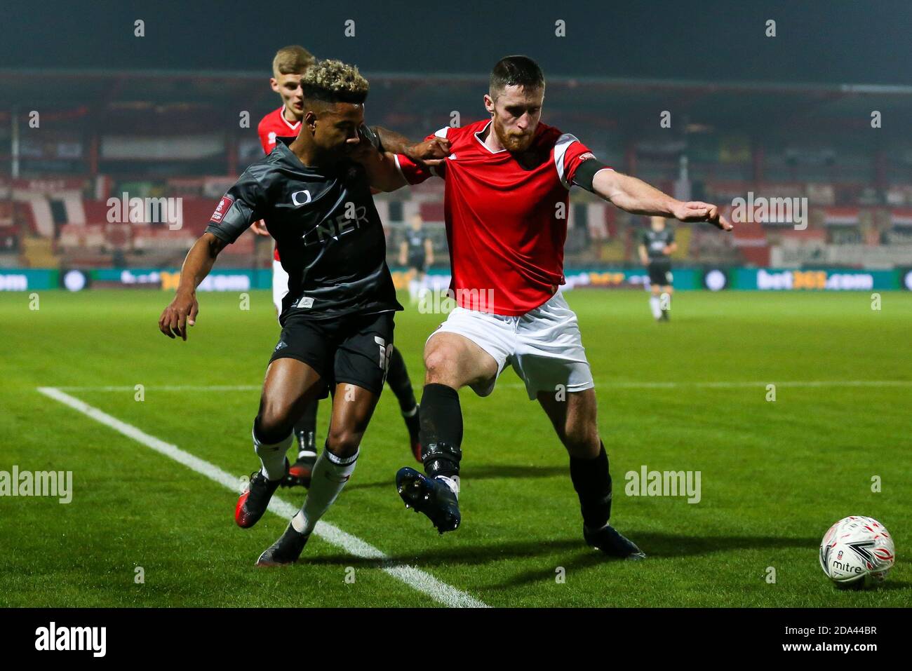 FC United of Manchester’s Adam Dodd and Doncaster Rovers’ Jason Lokilo ...