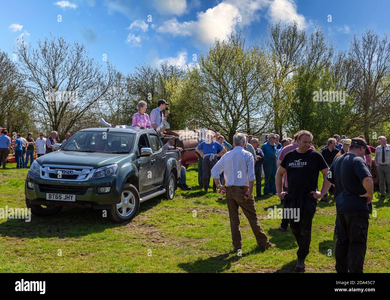 Auctioneer selling farming equipment at outdoor auction at Standerwick ...