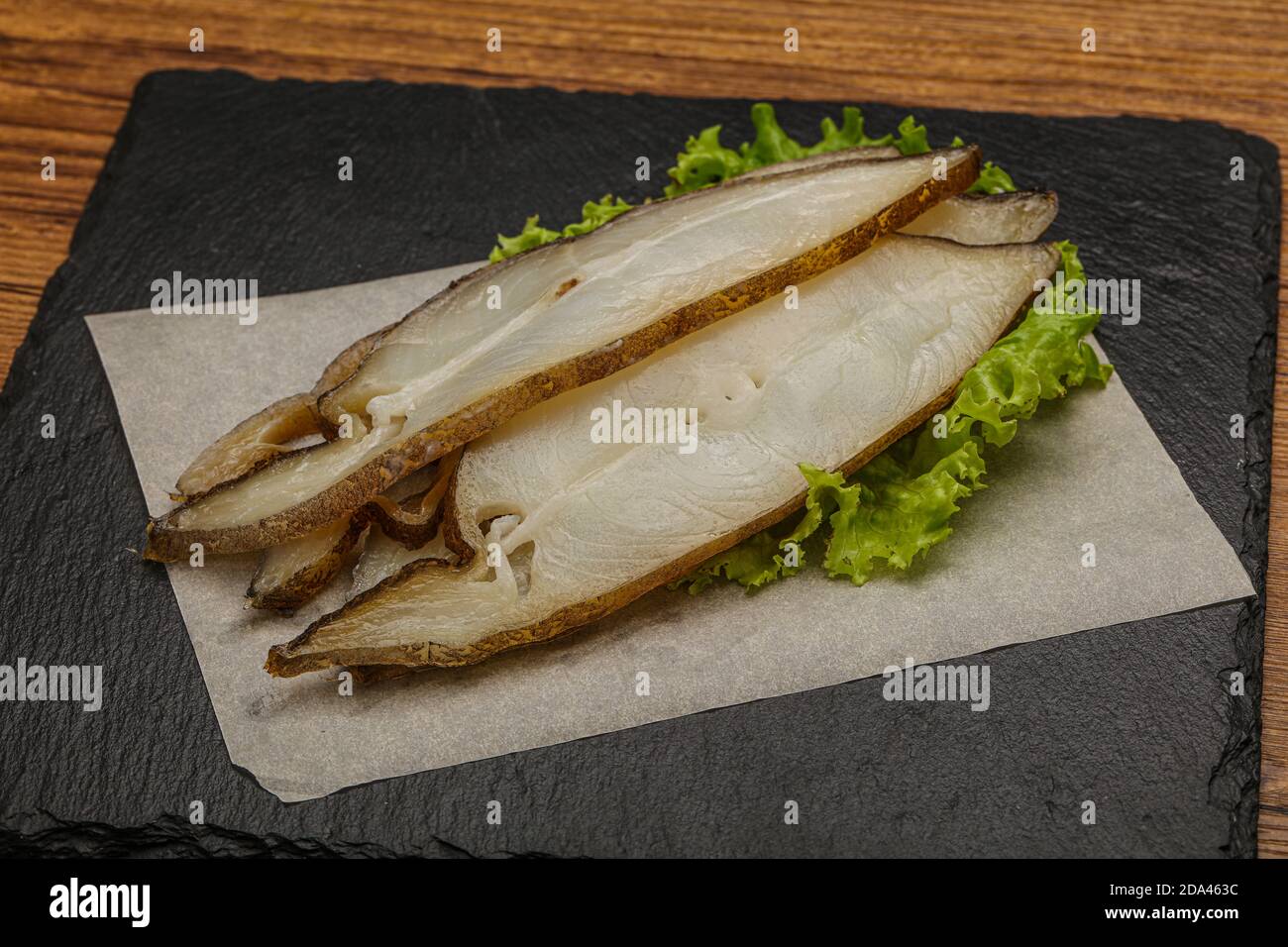 Delicous smoked halibut fish slices snack Stock Photo - Alamy
