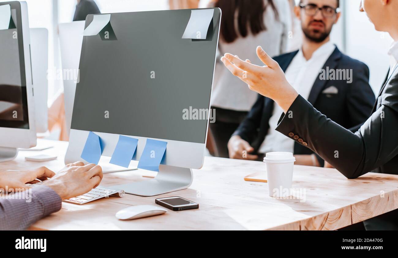 group of business people sitting at an office Desk Stock Photo - Alamy