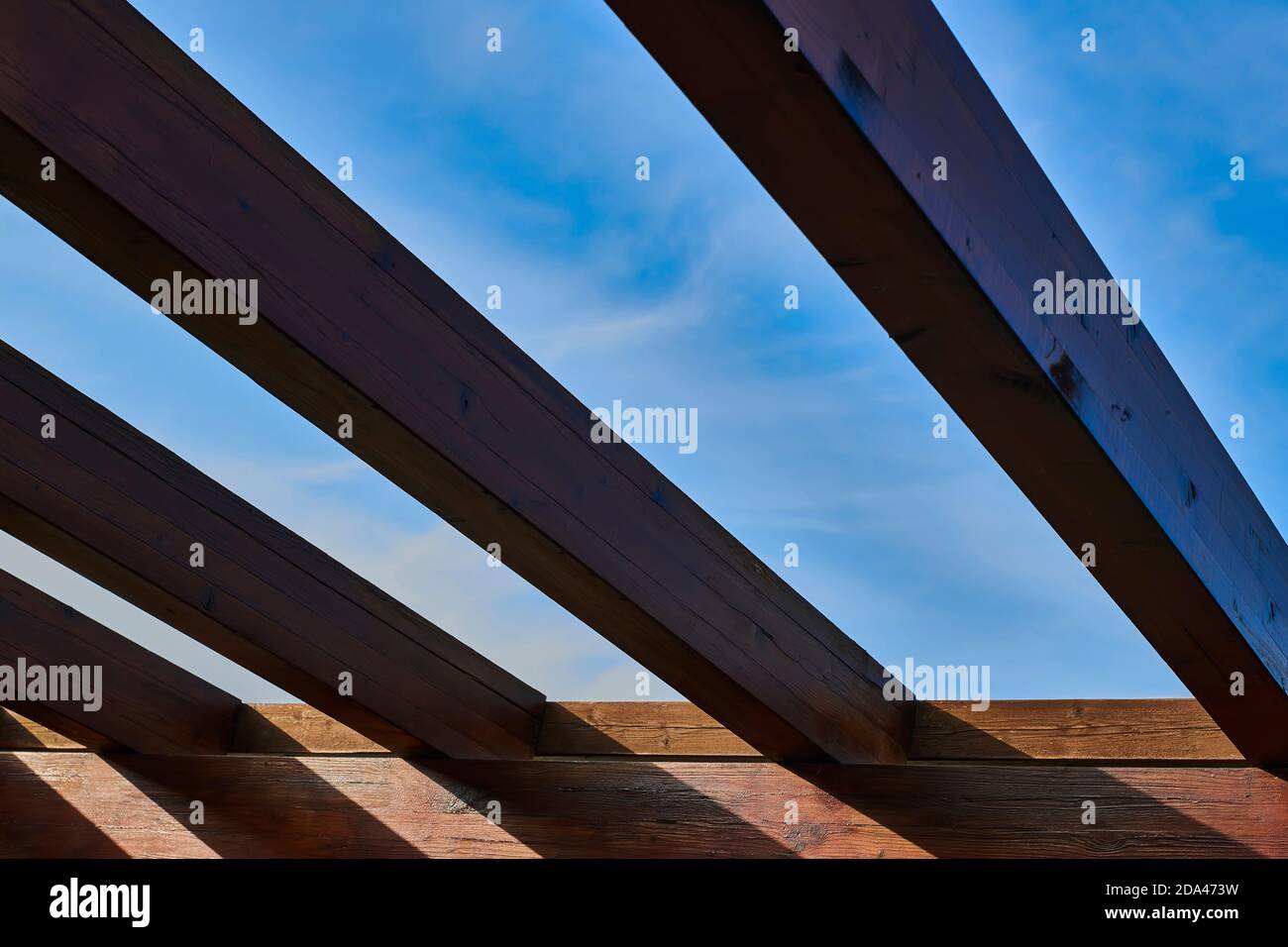Geometry of wooden beams architecture in direct sun Stock Photo - Alamy