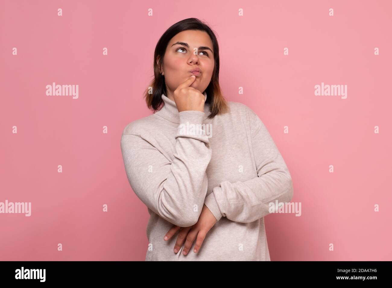 Caucasian woman with glasses having thoughtful look Stock Photo - Alamy