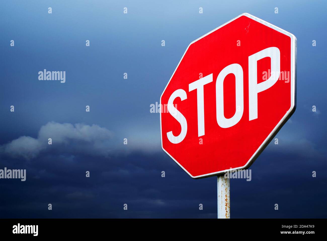 Conceptual stop sign with stormy background. Warning, caution and ...