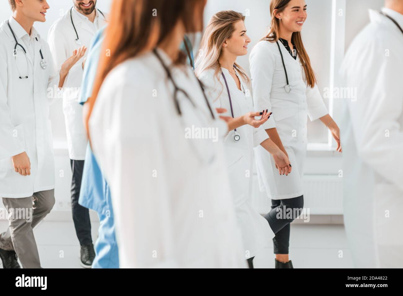 Healthcare professionals walk through hi-res stock photography and ...