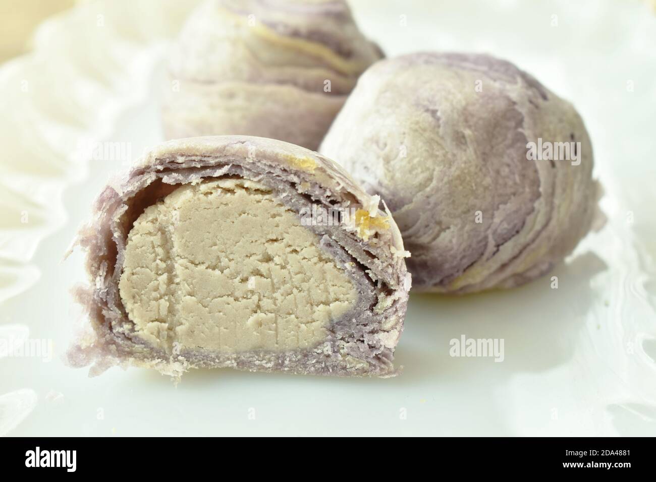 mashed taro stuffed cake half cut on plate Stock Photo - Alamy