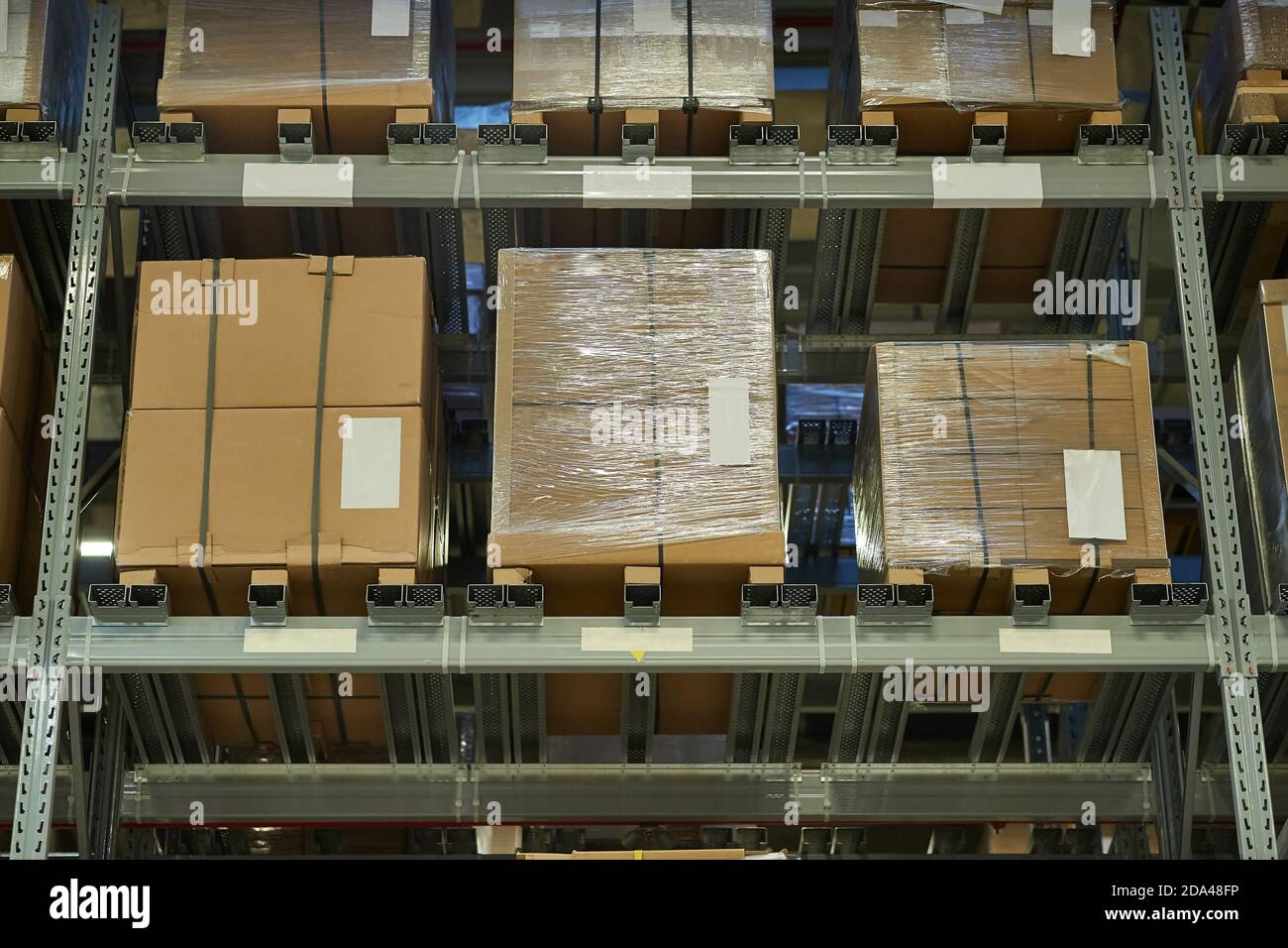 Warehouse with stocked shelves of boxes Stock Photo - Alamy