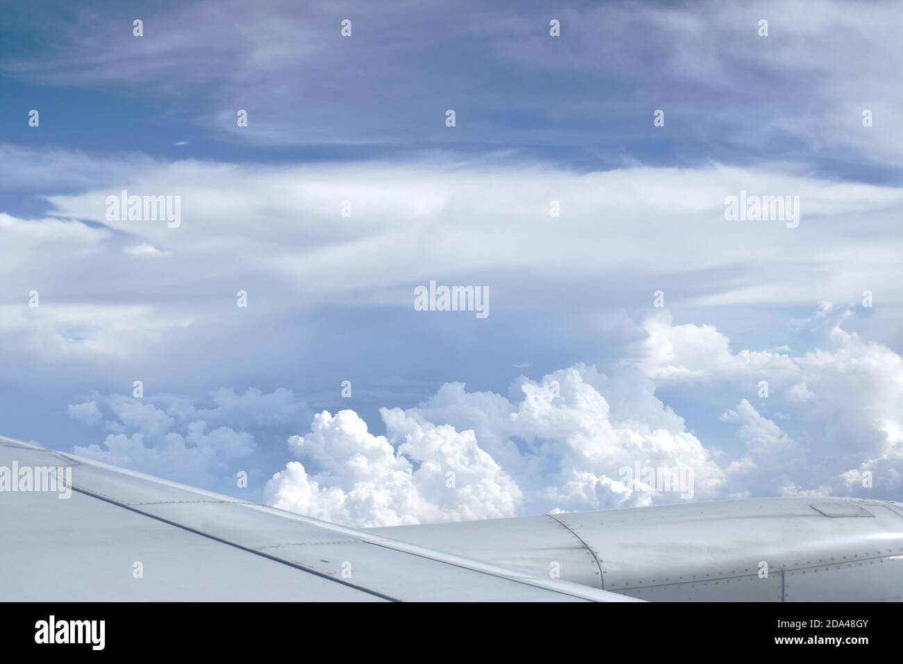 plane wing and cloud floating on sky through window frame Stock Photo ...