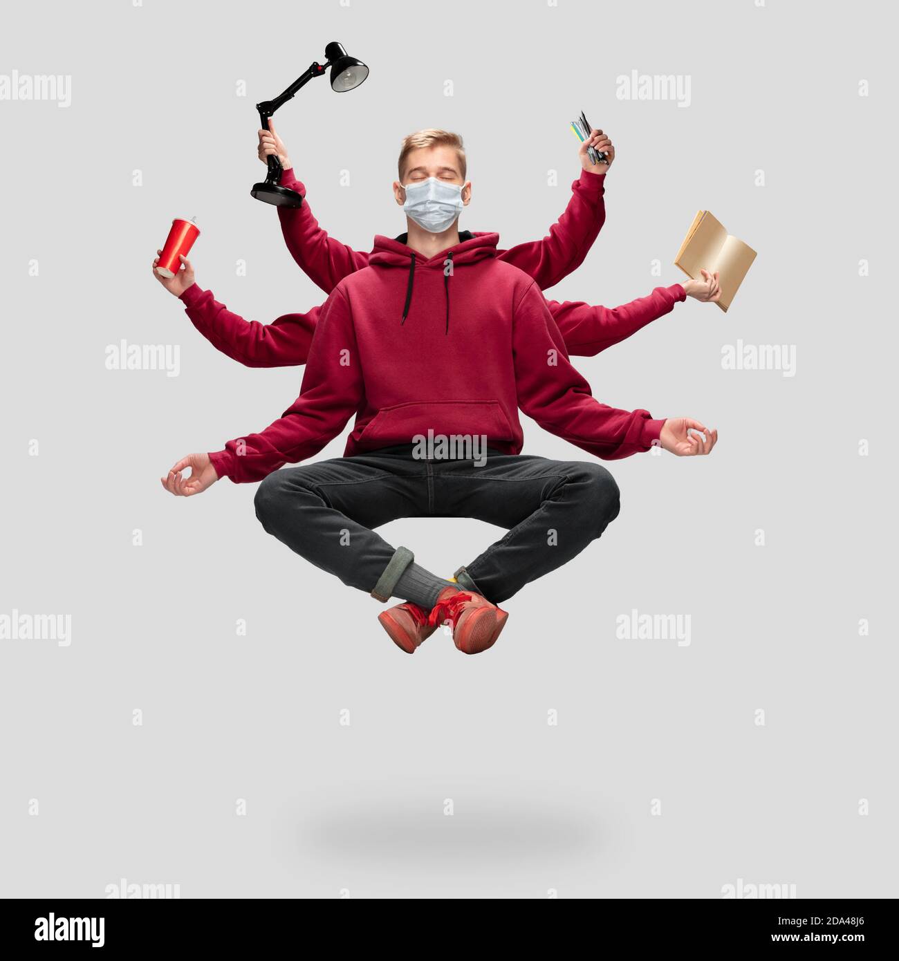 Handsome student, multi-armed man levitating isolated on grey studio ...