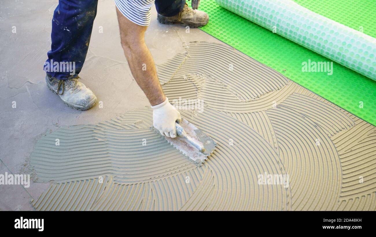 Applying tile mosaic hi-res stock photography and images - Alamy
