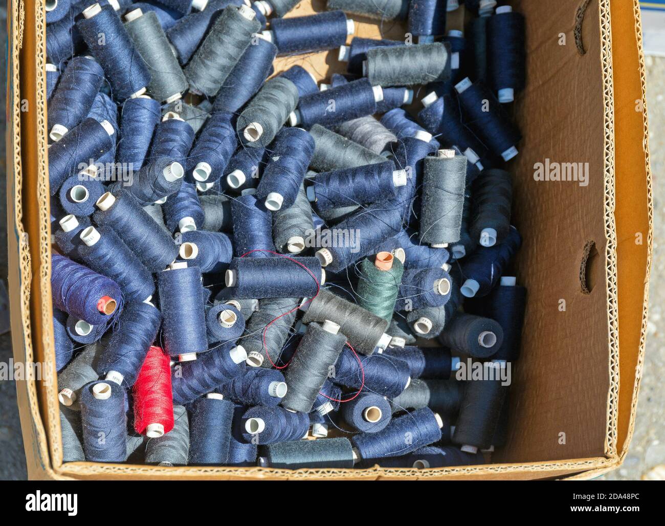 Big Box of Blue Sewing Thread Reels Stock Photo - Alamy