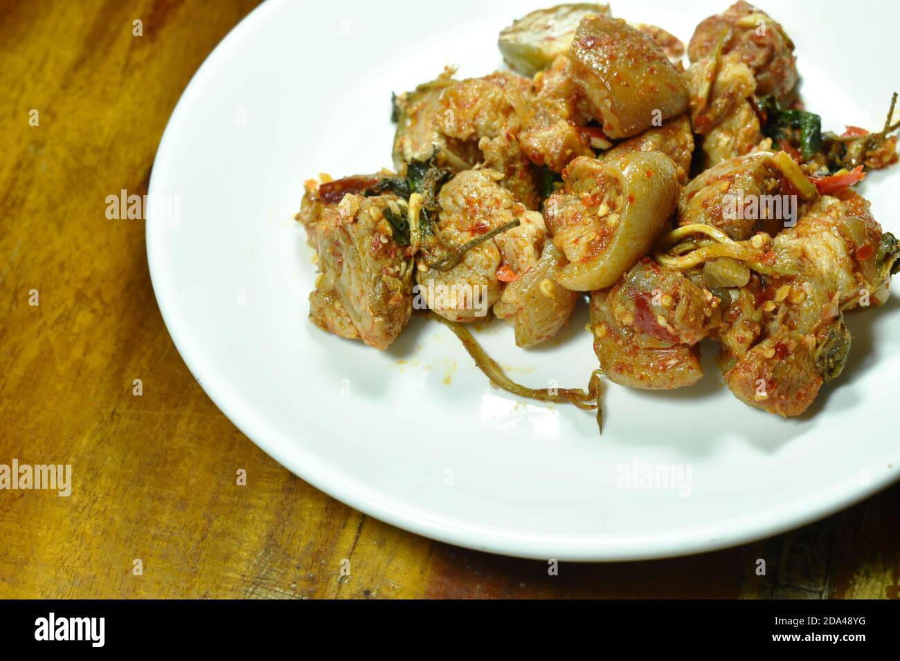 spicy stir fried slice pork leg with eggplant curry on plate Stock ...