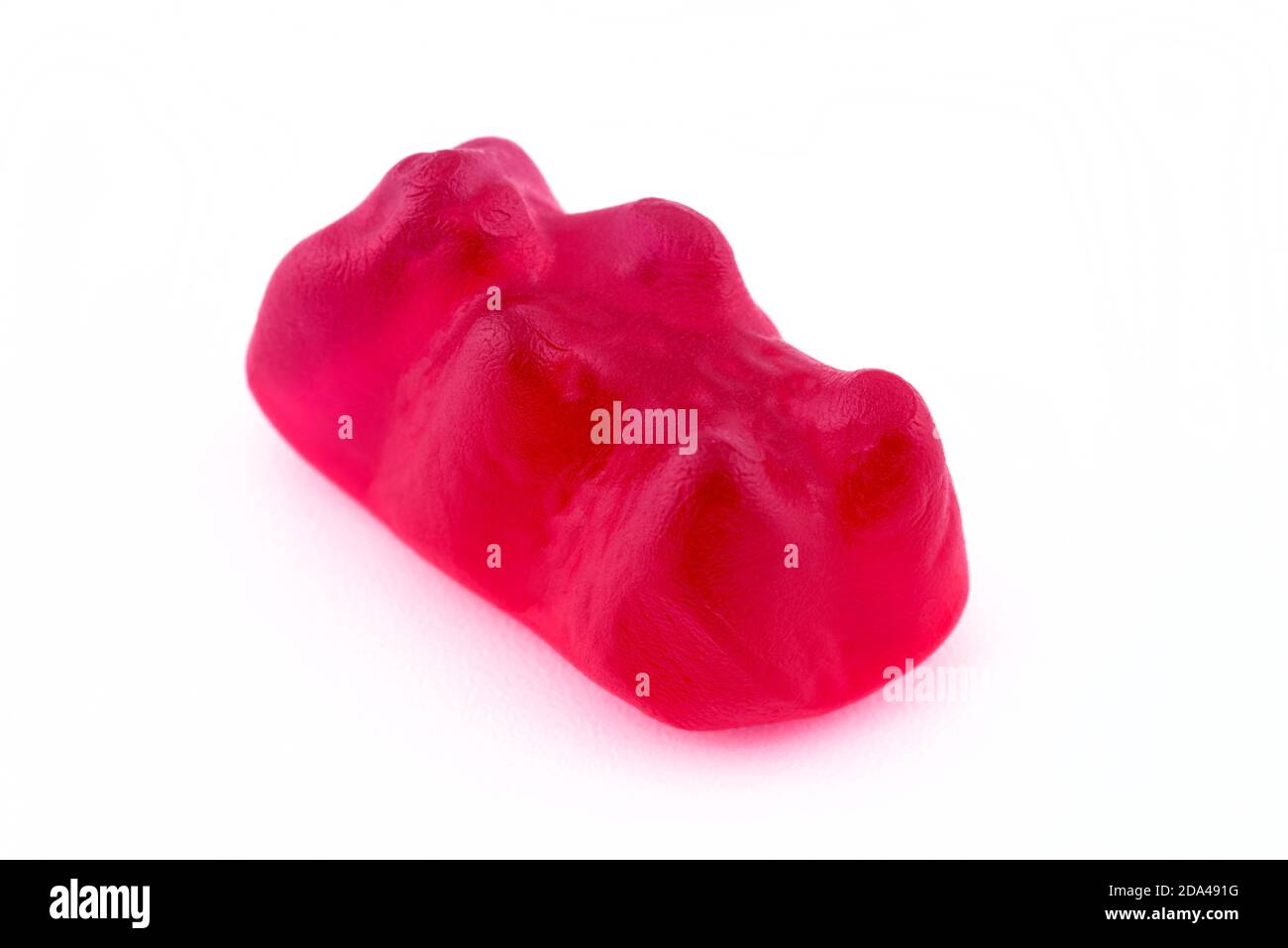 A macro shot of a pink gummy bear, isolated on a white background Stock ...