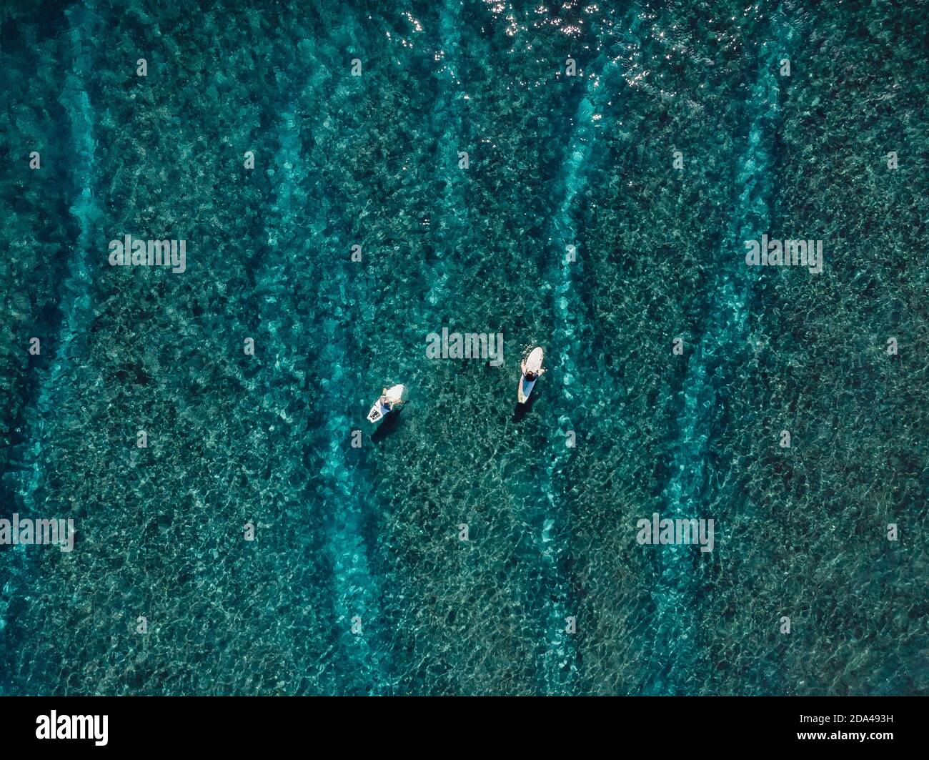 Aerial view of a surfers in blue ocean with waves. Top view Stock Photo ...
