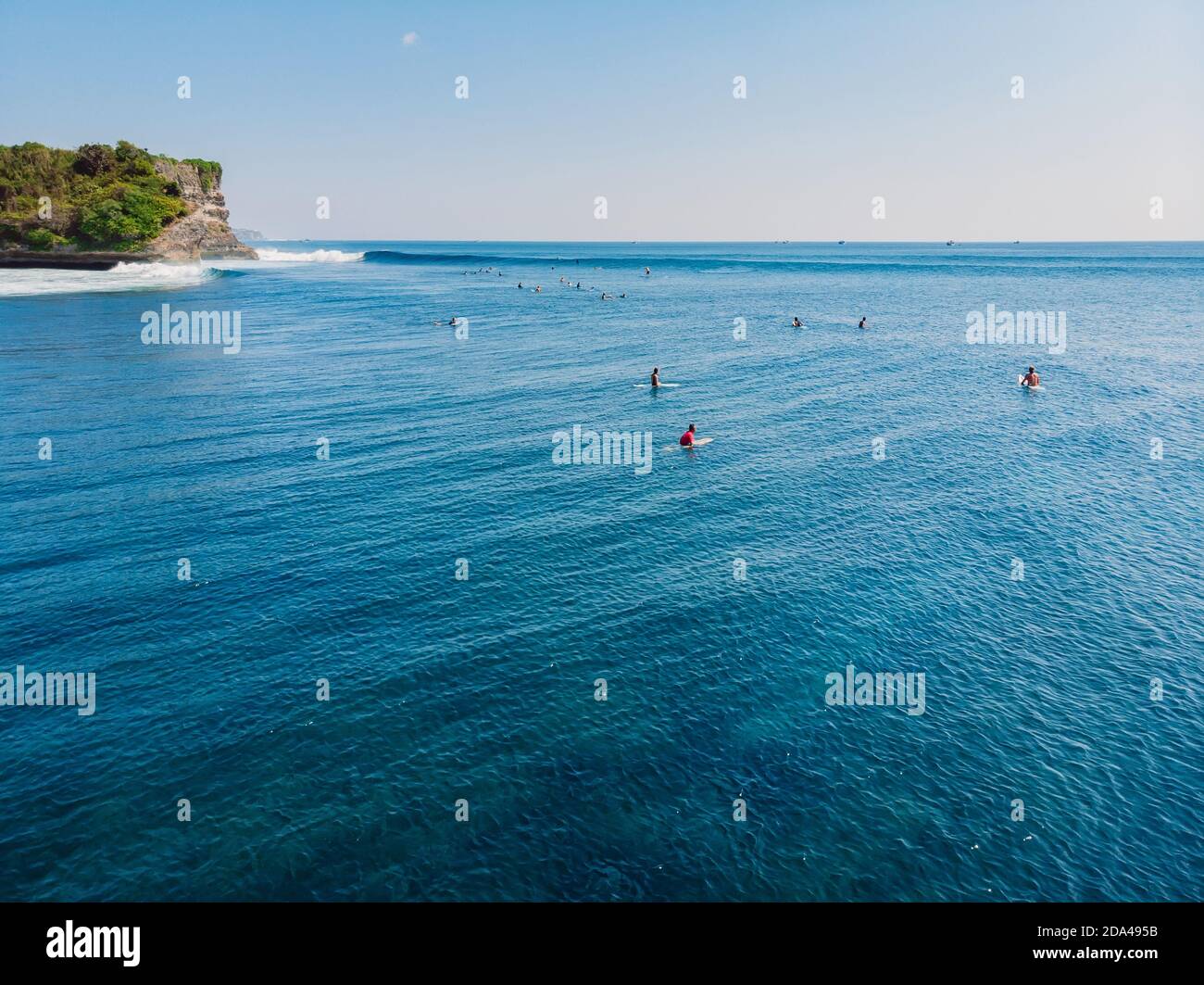 Aerial view of a surfers in blue ocean with waves. Top view Stock Photo ...