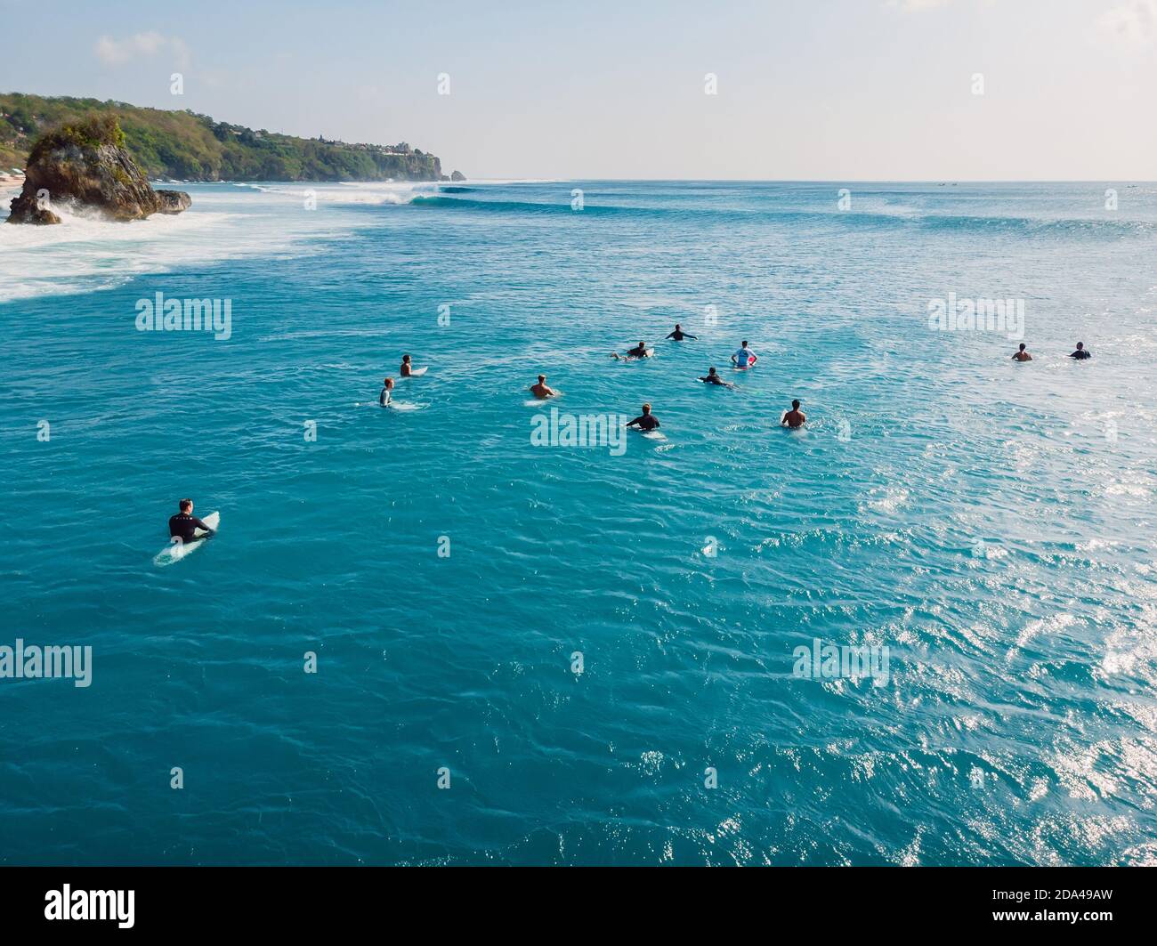 Aerial view of a surfers in blue ocean with waves. Top view Stock Photo ...