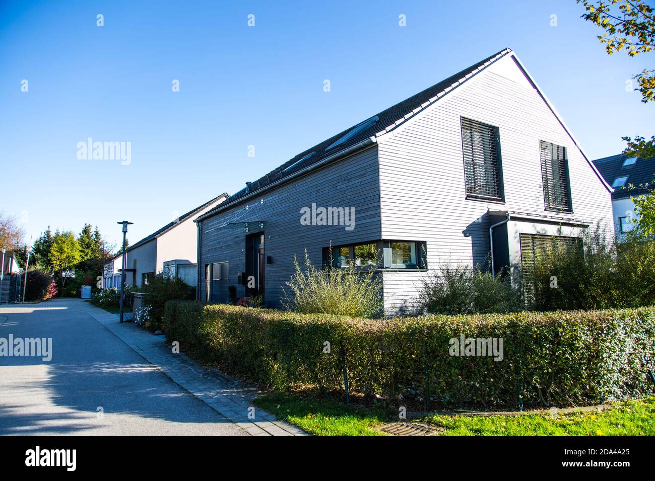 Modern wooden house in housing estate, Germany Stock Photo - Alamy