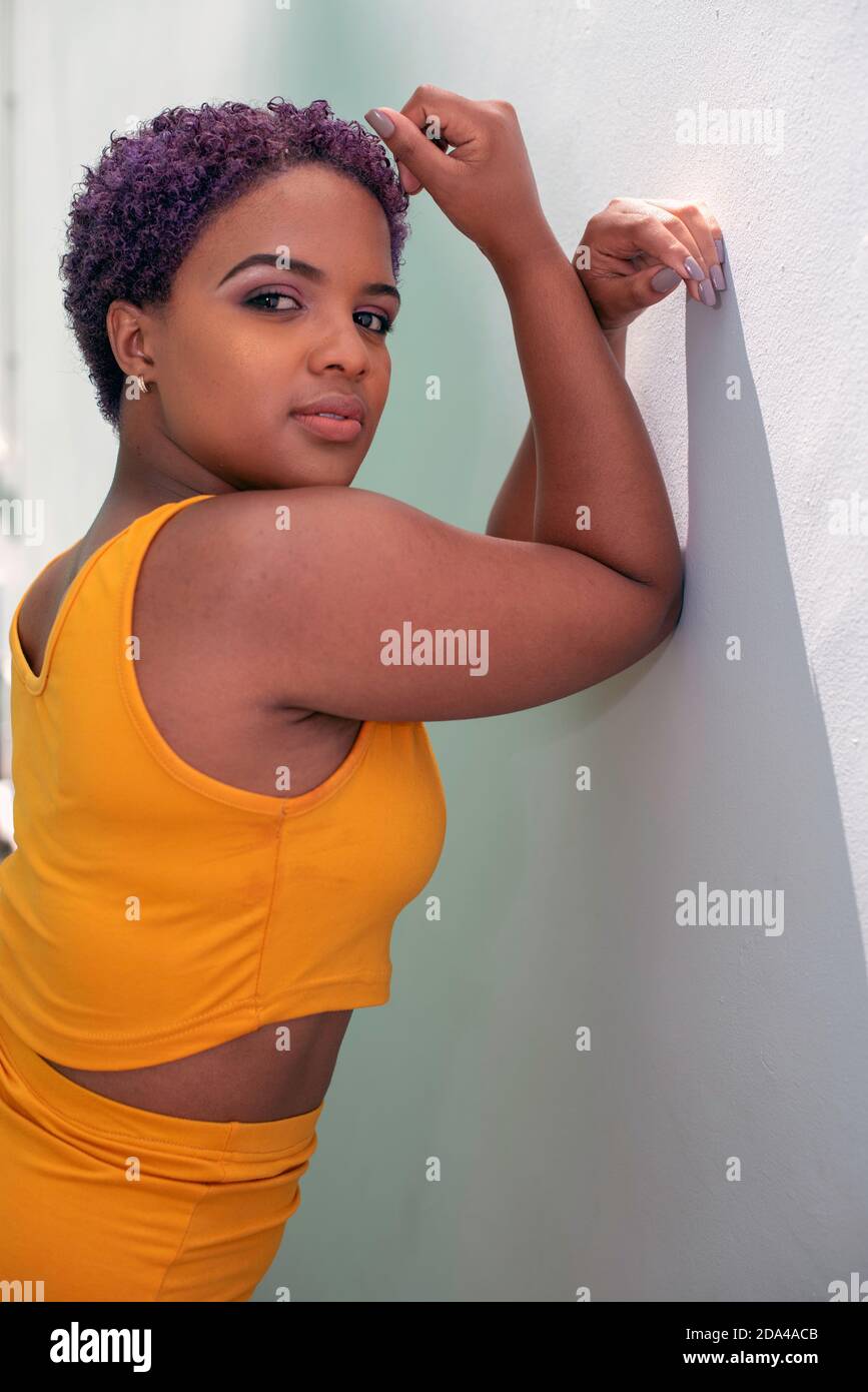 Woman lean against wall hi-res stock photography and images - Alamy