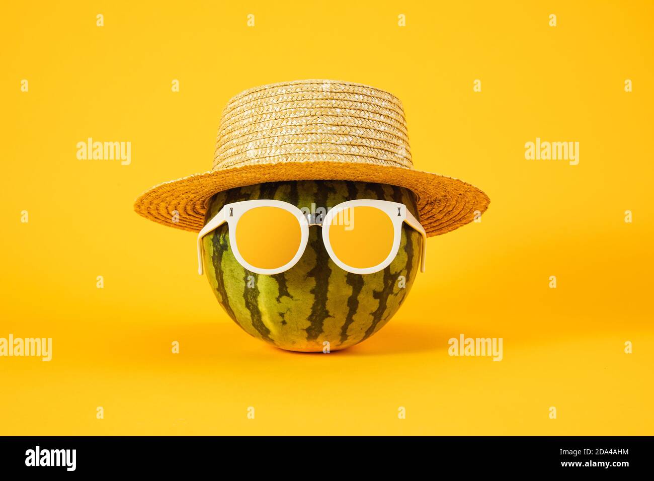 Cool image of watermelon with sunglasses and hat isolated on a yellow ...