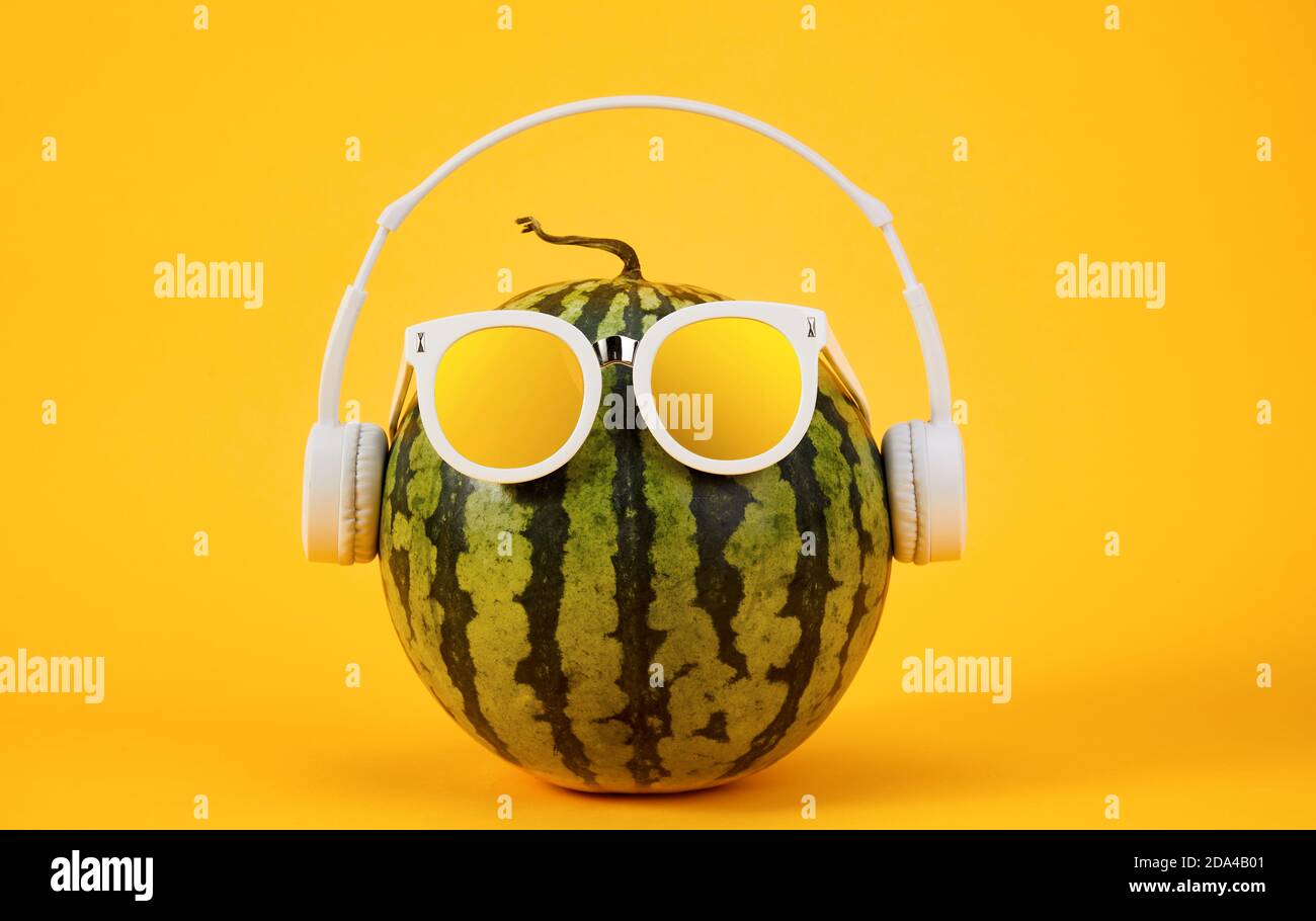 Cool image of watermelon with sunglasses and headphones isolated on a ...