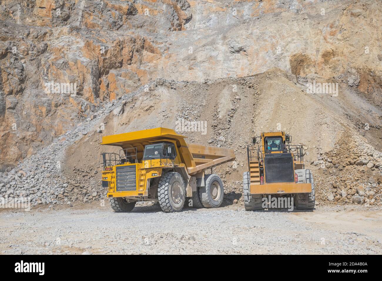 loader loading mining truck at open pit Stock Photo - Alamy