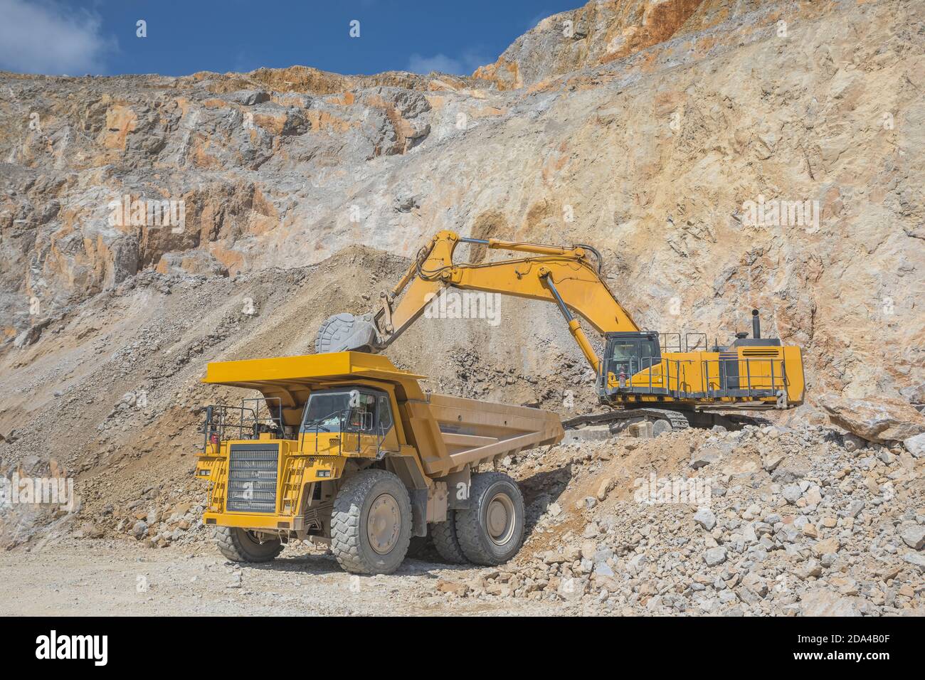 loader loading mining truck at open pit Stock Photo - Alamy