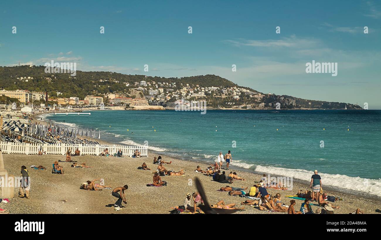 Seaside resort on Nice beach in France during summer time. A ...