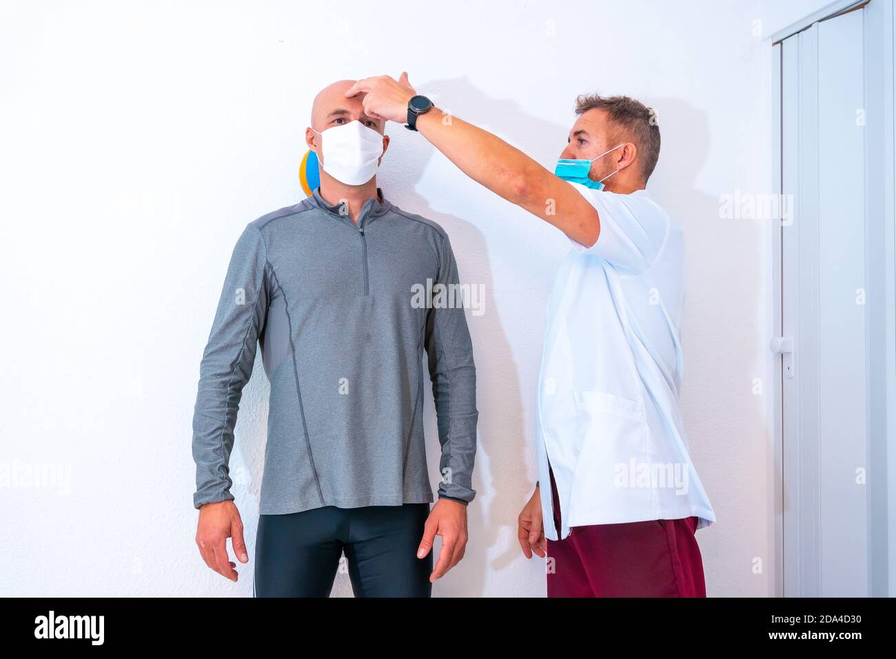 Healthcare professional guiding the patient at the rehabilitation gym ...