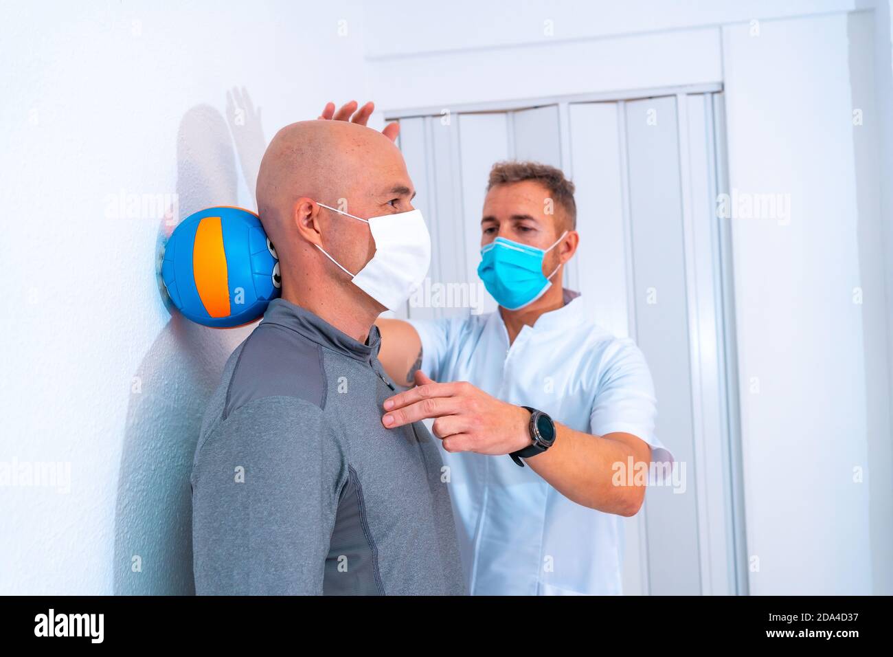 Healthcare professional guiding the patient at the rehabilitation gym ...