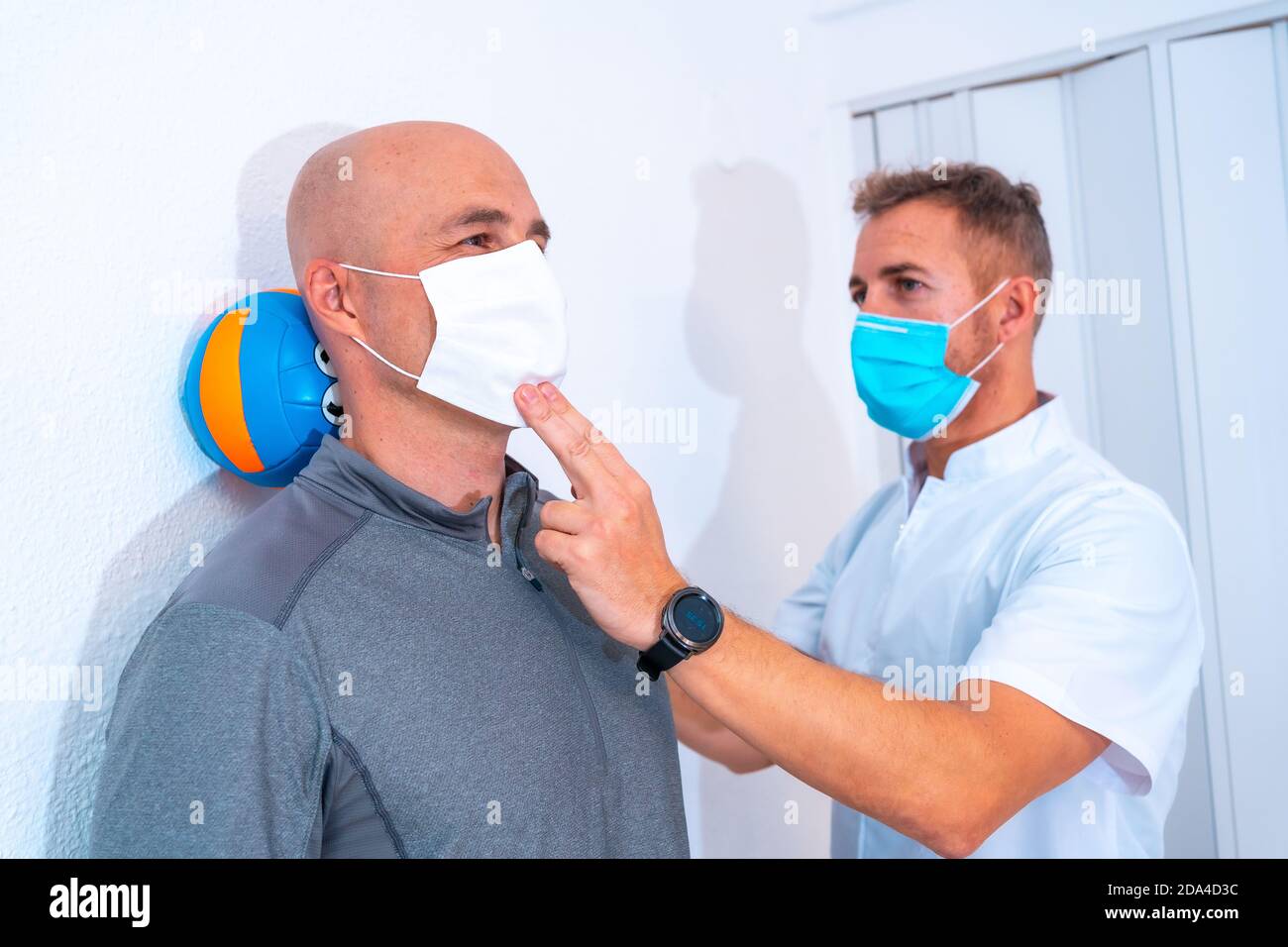 Healthcare professional guiding the patient at the rehabilitation gym ...