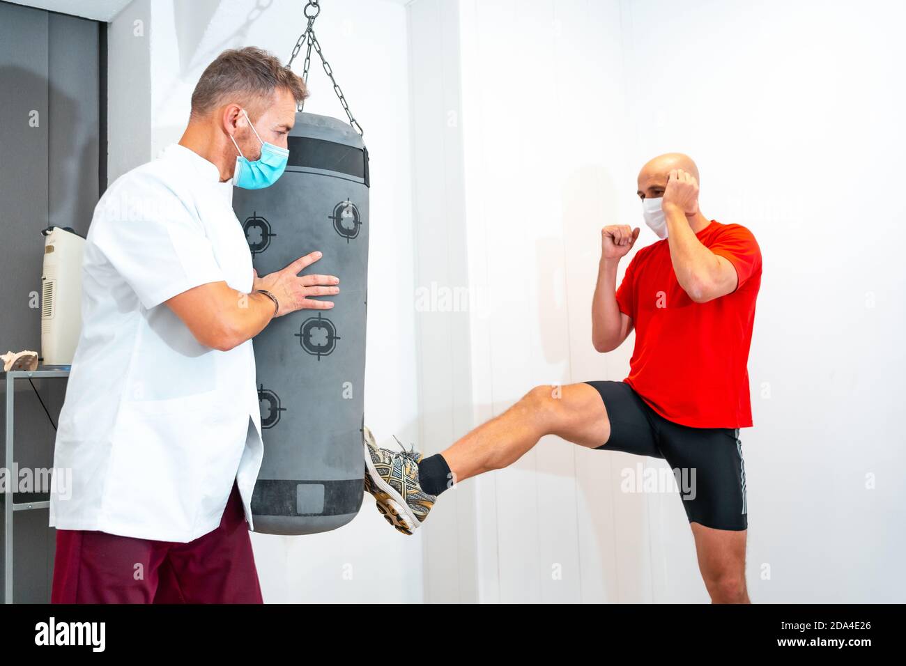 Healthcare professional guiding the patient at the rehabilitation gym ...