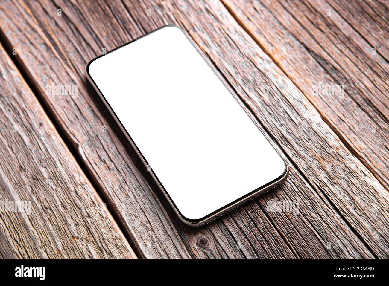 Smartphone with white screen on a background of wooden boards Stock ...