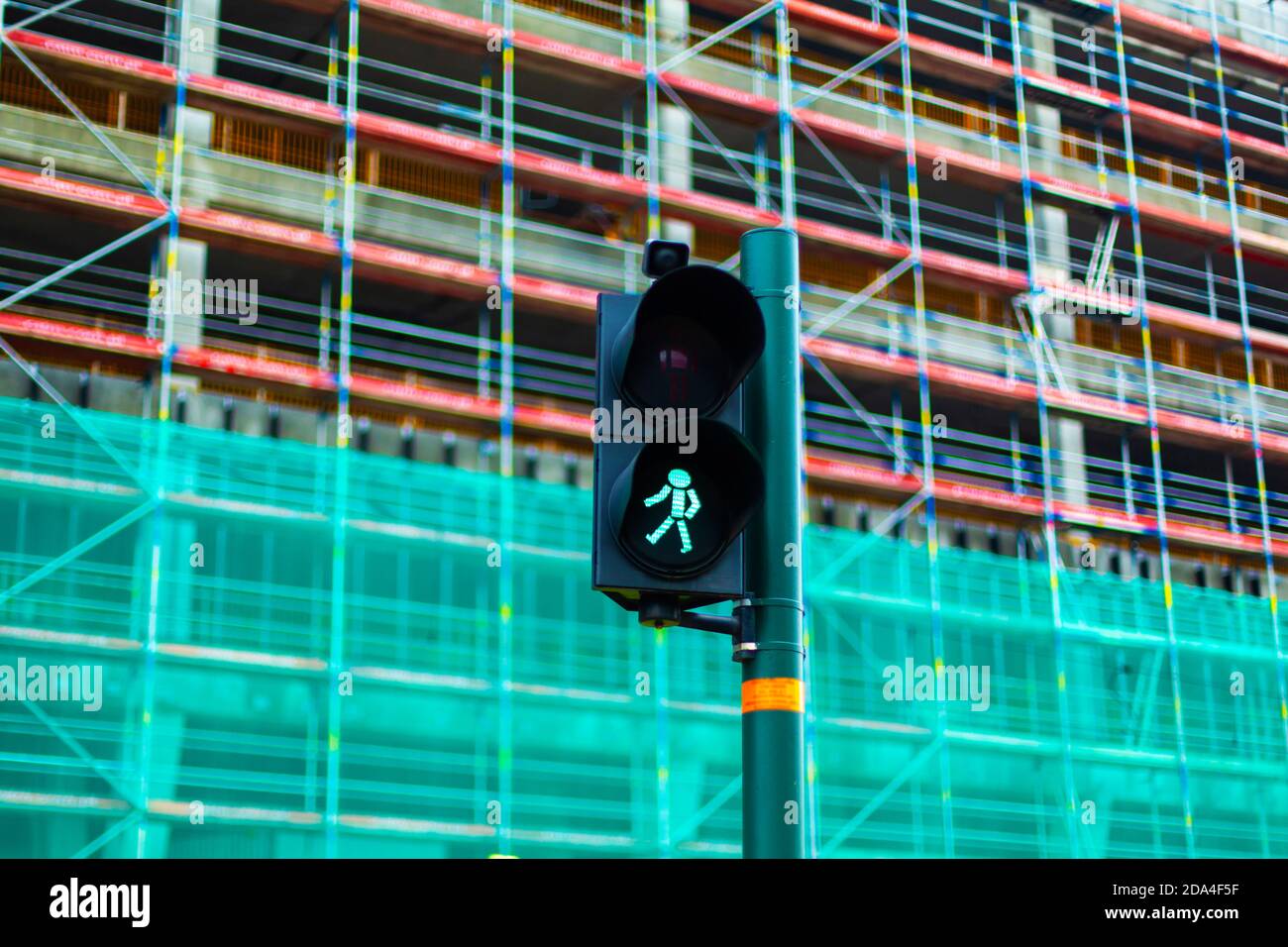 Pedestrian crossing traffic light with green man Stock Photo - Alamy