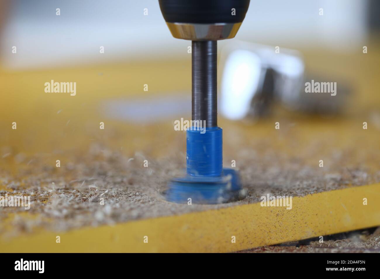 Professional worker using tool Stock Photo - Alamy