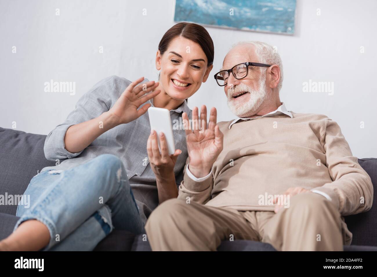 Daughter waving elderly hi-res stock photography and images - Alamy