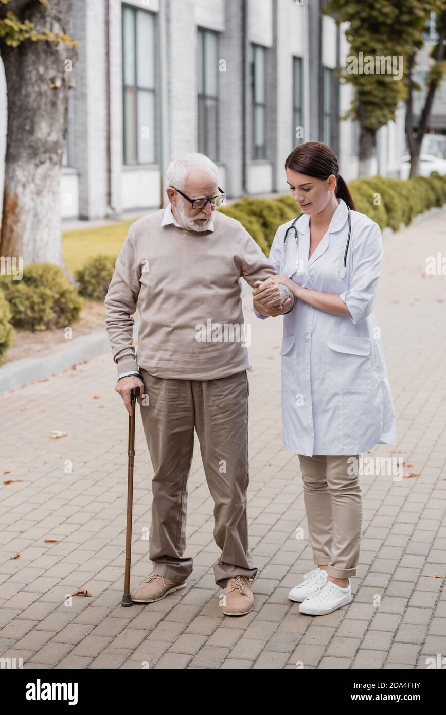 Elderly adult walking stick hi-res stock photography and images - Alamy