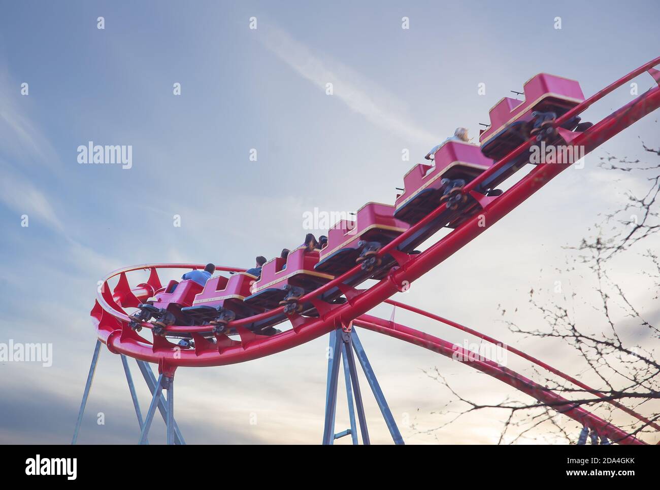 people on the roller coaster ride on the cloud sky background Stock ...