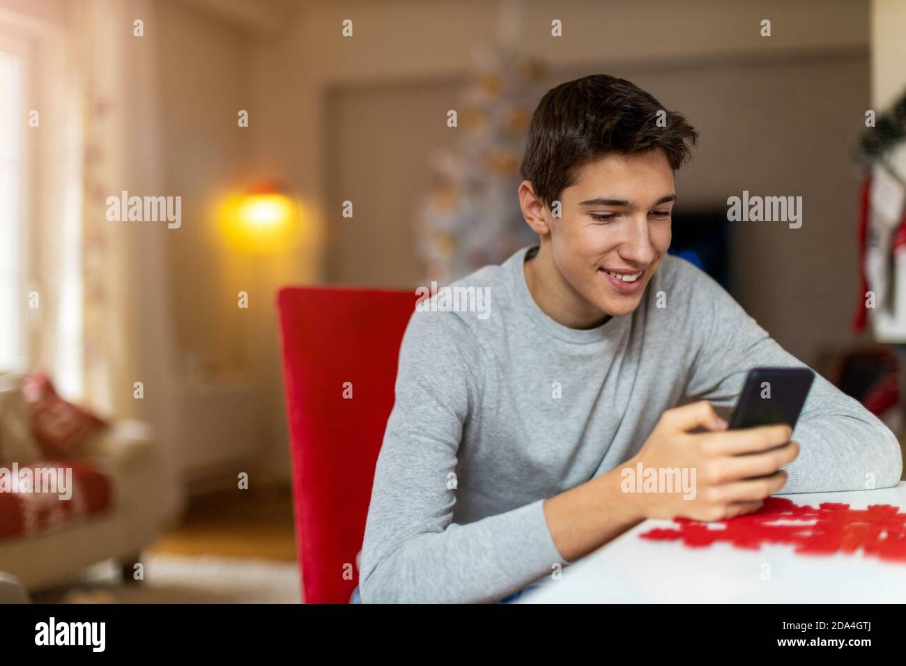 Teenage boy man using mobile hi-res stock photography and images - Alamy