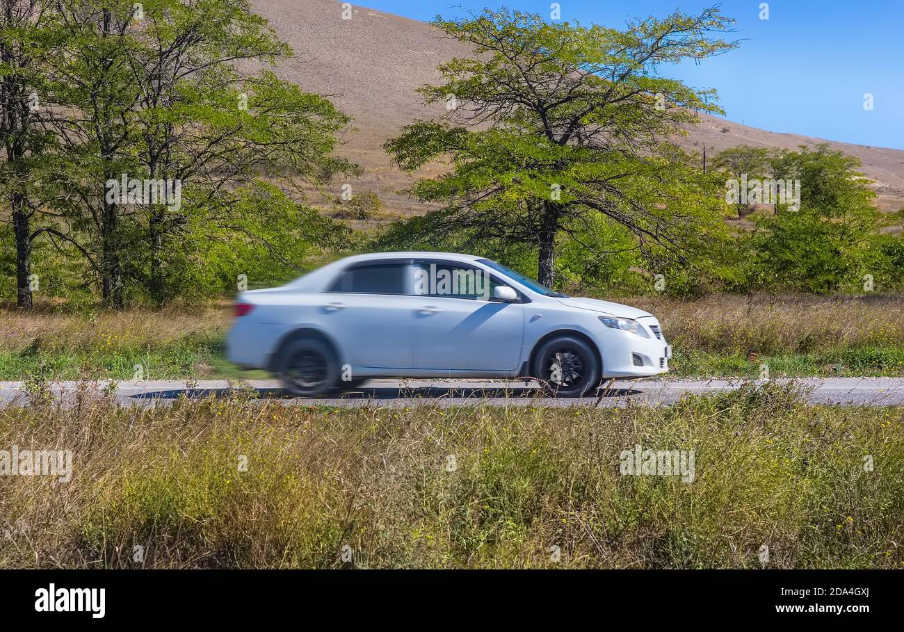 car rides on the highway in summer in a hilly area Stock Photo - Alamy